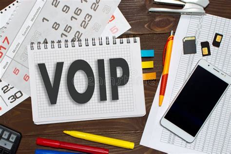 notebook with a notes voip on the office table with tools stock image