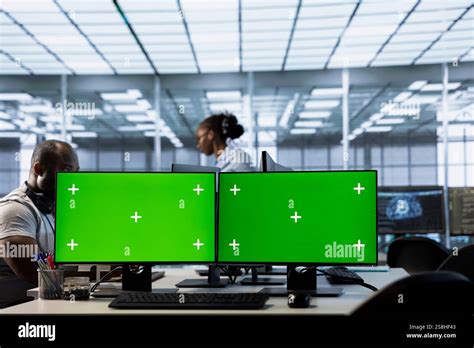 Multi Monitor Isolated Screen Computer Setup Used By Engineers Working In Server Hub Processing