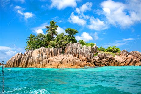Beautiful Island Of Seychelles Granite Cliffs Of The Beach With Palm