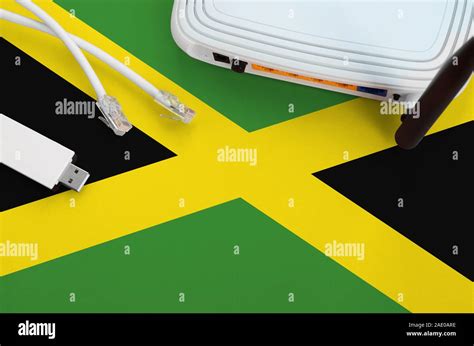 Jamaica Flag Depicted On Table With Internet Rj Cable Wireless Usb Wi Fi Adapter And Router