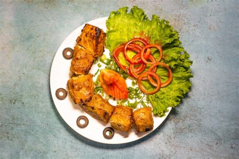 Premium Photo Fish Tikka Boti Kabab Platter With Lime And Salad In A