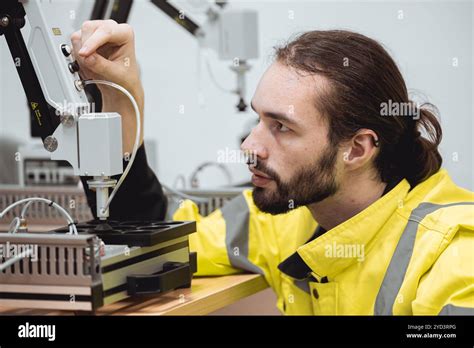 Engineer Male Education In Industrial Robotics Program In University Engineering Lab Classroom
