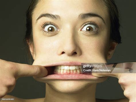 Young Woman Stretching Lips Pulling Funny Face Closeup Portrait Stock