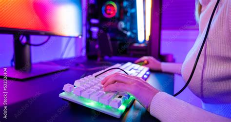 Close Up Gamer Hands Actively Pushing Buttons With Colorful Neon Led Lights Woman Guy Typing On