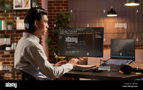 Asian Programmer Using Binary Code To Script Security System