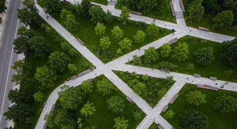 Aerial View Of A Park With Intersecting Concrete Paths Forming An X