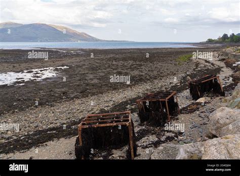 Beautiful Shot Of A River During Low Tide With Old Metallic Structure