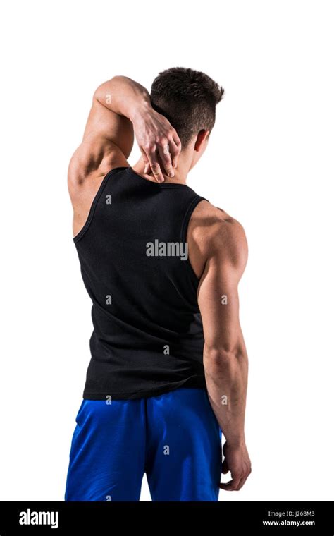Attractive Muscular Young Mans Back In T Shirt And Short Massaging