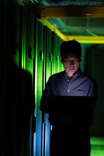Premium Photo Asian Male Engineer Using Laptop In Computer Server