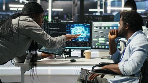 Admin In Wheelchair And Data Center Coworker Work Together Using Node Tree Tool Stock Footage