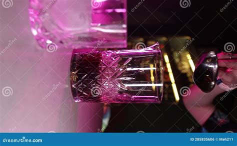 vertical video adding ice to cocktail stock footage video of