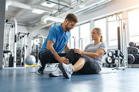 Premium Photo Physical Therapist Working With A Patient In A Bright Gym