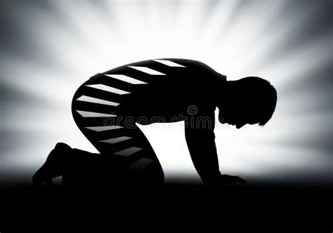 Silhouette Of Person Kneeling With Light Rays Emanating From Behind