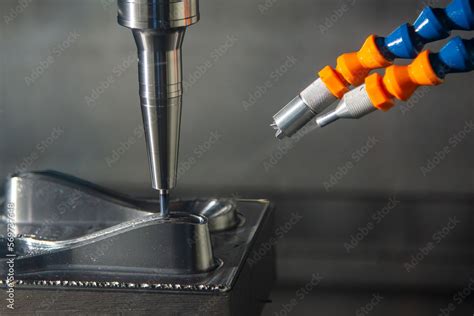 The CNC Milling Machine Cutting Injection Mold Part With Oil Mist Coolant Method Stock Photo