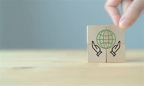Social Responsibility Core Value Concept With Hand And Globe Icon On