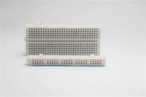Breadboard With Its Power Rails Separated From The Main Part Isolated On White Background Stock