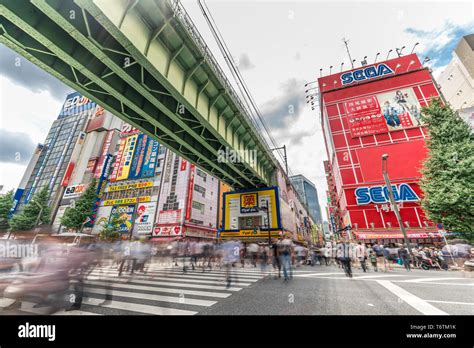 Colorful Bilboard Advertisements Motion Blurred Crowd At Chuo Dori