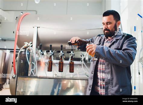Portrait Of Brewer Who Is Making Beer On His Workplace In The Brew House Stock Photo Alamy