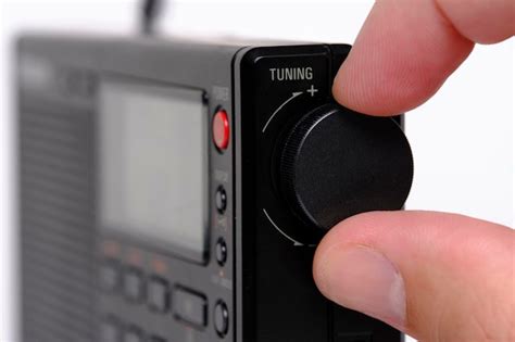 Premium Photo Fingers Turn Rotary Wheel Radio Waves Tuning Radio Receiver