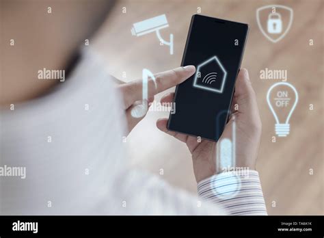 Man Using Smartphone To Control Smart Home Smart House Concept Stock Photo Alamy