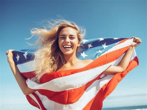 Young Smiling Woman Holding Usa Flag In Her Hands On Blue Sky