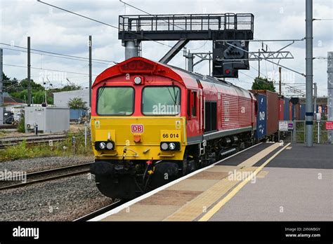 Db Class 66 Diesel Leads Train Of Containers South Through Peterborough Cambridgeshire England