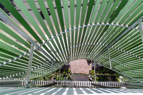 Reused Wooden Panels Compose Aqua Jardins Undulating Facade In Vietnam