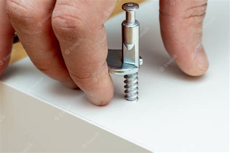 Premium Photo Furniture Assembling Process Screwing Tightening The