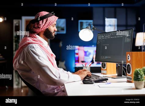 Image Shows An Arab Software Developer Working At The Pc Monitor Seated At A Workstation