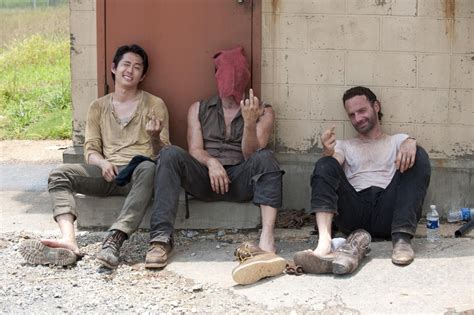 Download Boots Barefoot Steven Yeun Norman Reedus Andrew Lincoln Tv Show The Walking Dead Image