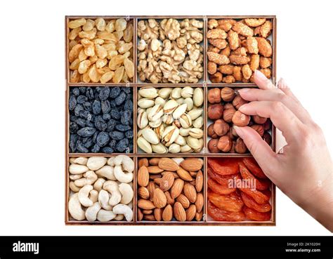 Hand With Assorted Nuts And Dried Fruit Collection Assorted Nuts