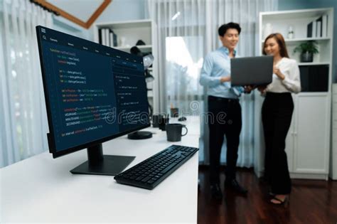 Running Coding Screen With Blurry It Developers Standing With Laptop Infobahn Stock Image