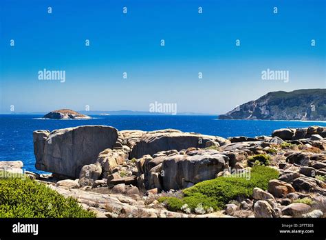 Coastal Landscape With Rocks High Cliffs And An Island At The Gap In
