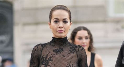 Rita Ora Goes Sheer In Lace Maxi Dress For Alaïas Spring 2024 Show At