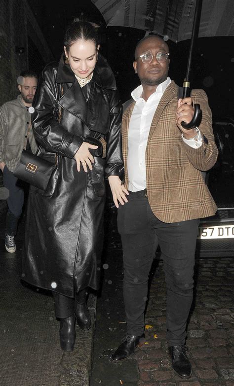 Lily James In A Black Leather Coat Celebrated Her 34th Birthday With Male Companions In London