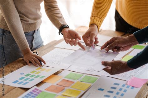 A UX Design Team Is A Confluence Of User Research UX UI Design With Layout Paper On Desk