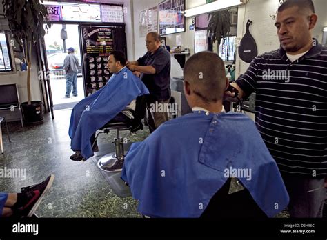 Young Hispanic Locals Getting Haircuts At Oaxaca Barber Shop On La