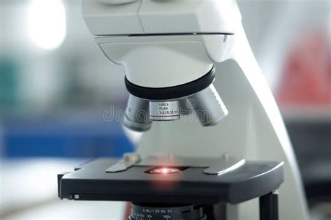 Closeup Of A White Microscope In A Laboratory Setting Stock Image Image Of Microscope