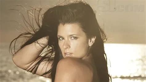 Danica Patrick Accessorized Her Stunning White Swimsuits With Racing Gear During Her Photoshoot