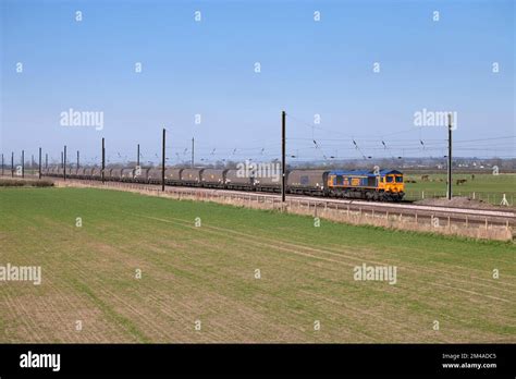 Gb Railfreight Class 66 Diesel Locomotive 66730 Hauling A Train Load Of