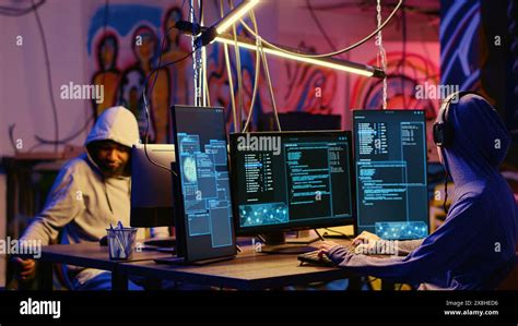 Hackers In Secret Bunker With Graffiti Walls Writing Code That Spoofs