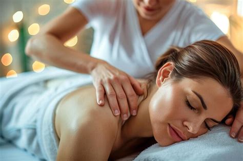 Young Woman Receiving A Back Massage In A Spa Center Premium Ai