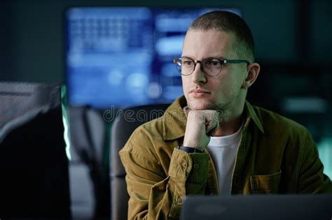 Portrait Of Male Software Developer Thinking Over Code Problem While Working In Office Stock