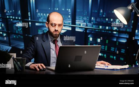 Male Infrastructure Engineer Working In Render Farm Running Diagnostics