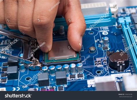 Assembling High Performance Personal Computer Inserting Cpu Processor Into The Motherboard