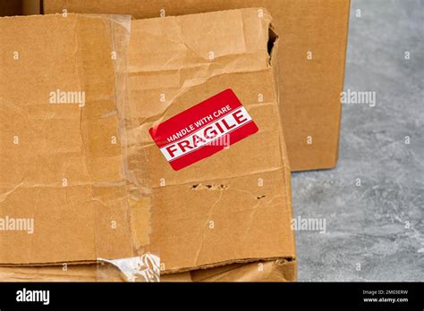 Damaged Cardboard Box With Fragile Label Package Insurance Mail