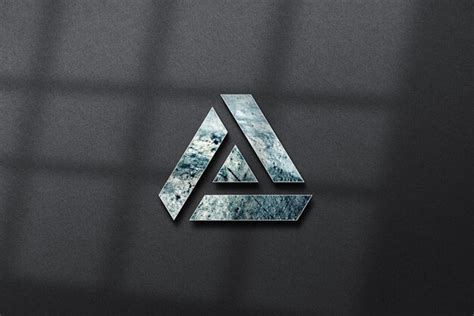 콘크리트 모양의 그림자에 은색 삼각형 로고 모형 프리미엄 Psd 파일