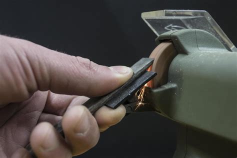 Master Sharpens A Chisel On A Grinding Machine 2545048 Stock Photo At Vecteezy