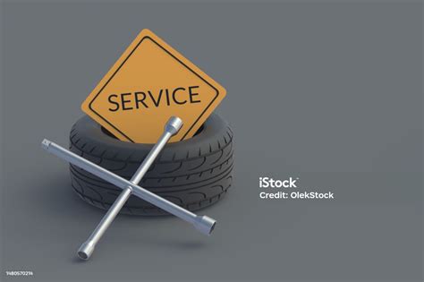 크로스 휠 렌치와 타이어 근처에 비문 서비스가 있는 도로 표지판 자동차 서비스 자동차 타이어 장착 자동차 타이어 피팅 공간을 복사합니다 3d 렌더링 3차원 형태에 대한 스톡