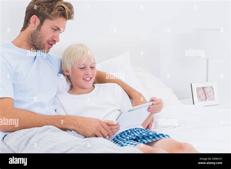 Father And His Son Using A Tablet Stock Photo Alamy